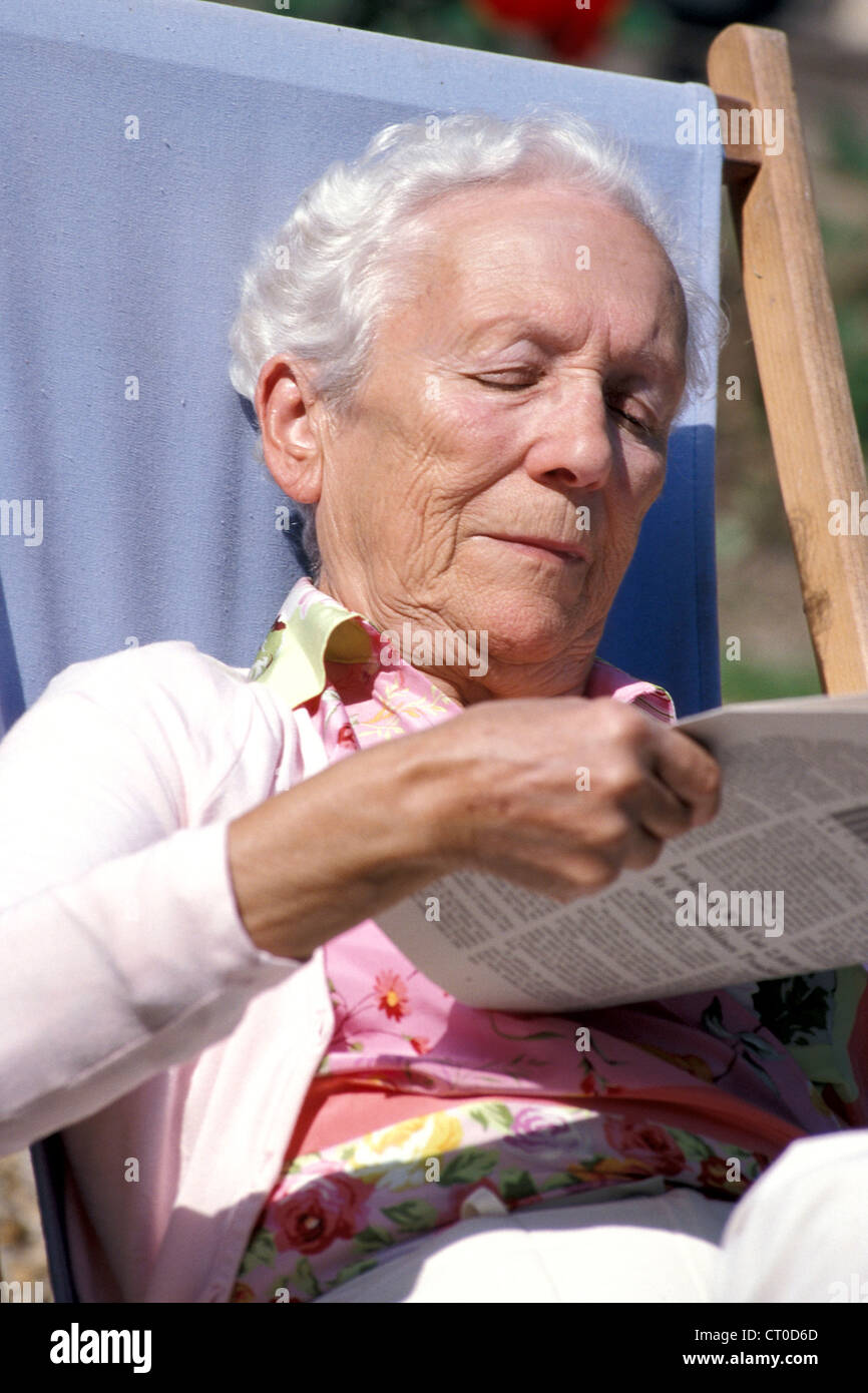 ELDERLY PERSON READING Stock Photo - Alamy
