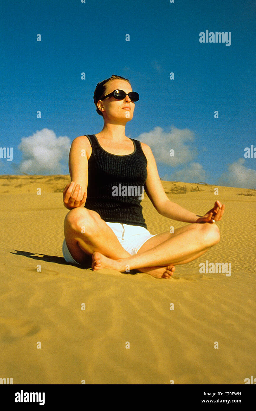Woman beach taking beach sun tanning hi-res stock photography and ...