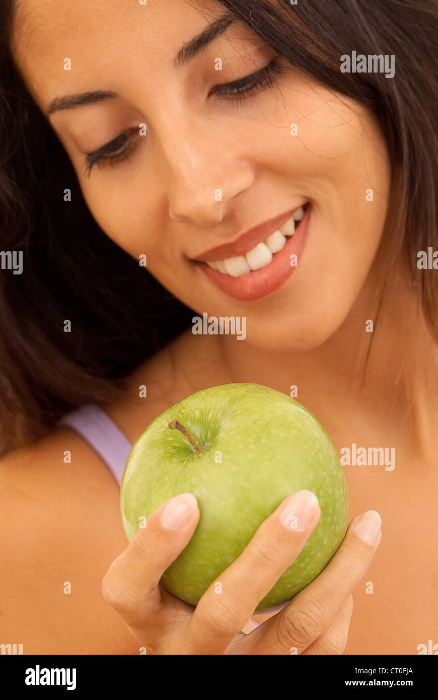 WOMAN EATING FRUIT Stock Photo - Alamy