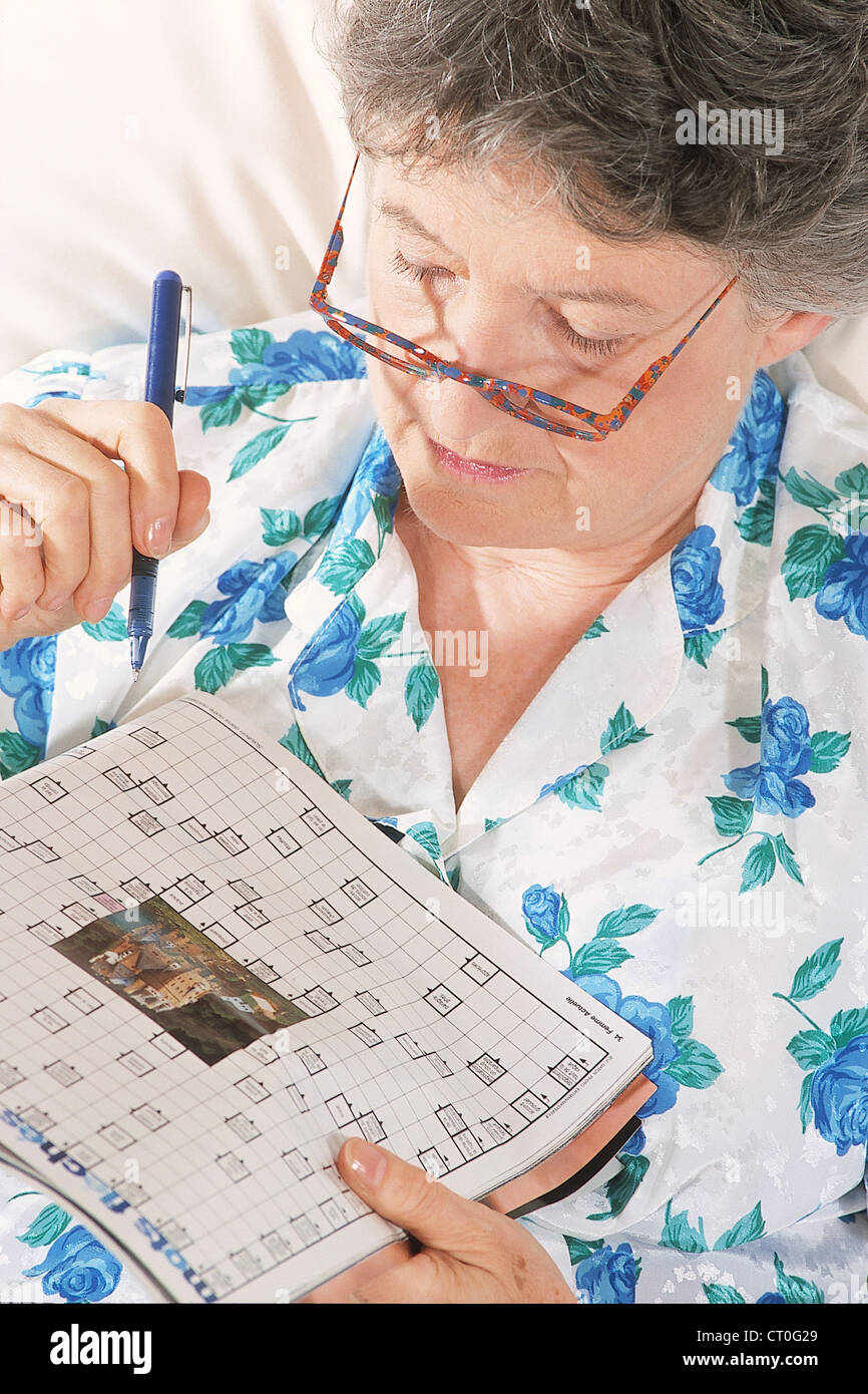 Crossword puzzle older women hi-res stock photography and images - Alamy