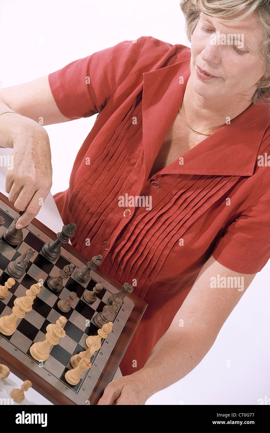 Old lady playing chess hi-res stock photography and images - Alamy