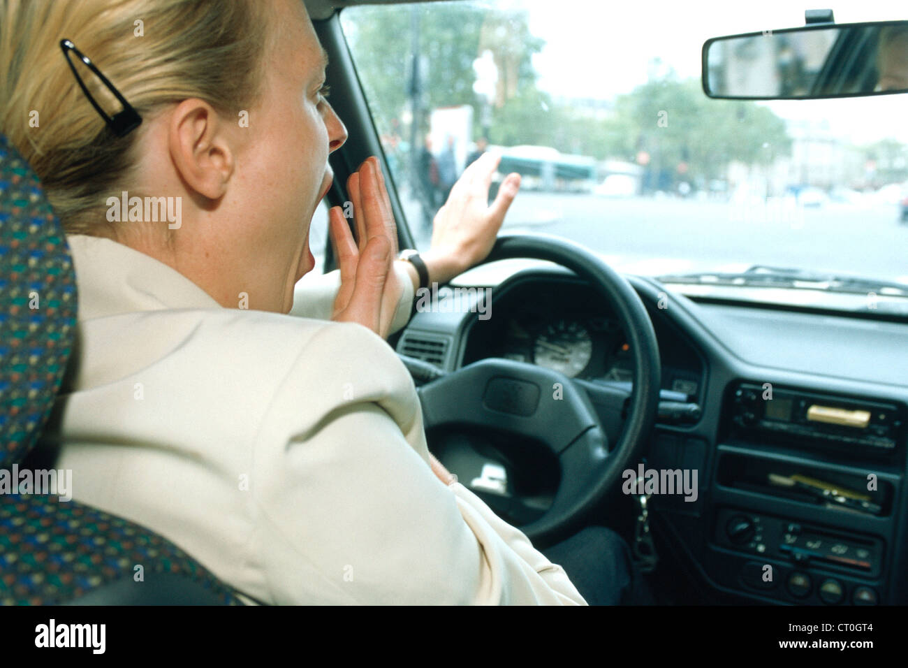 Exhausted driver yawning driving hi-res stock photography and images ...
