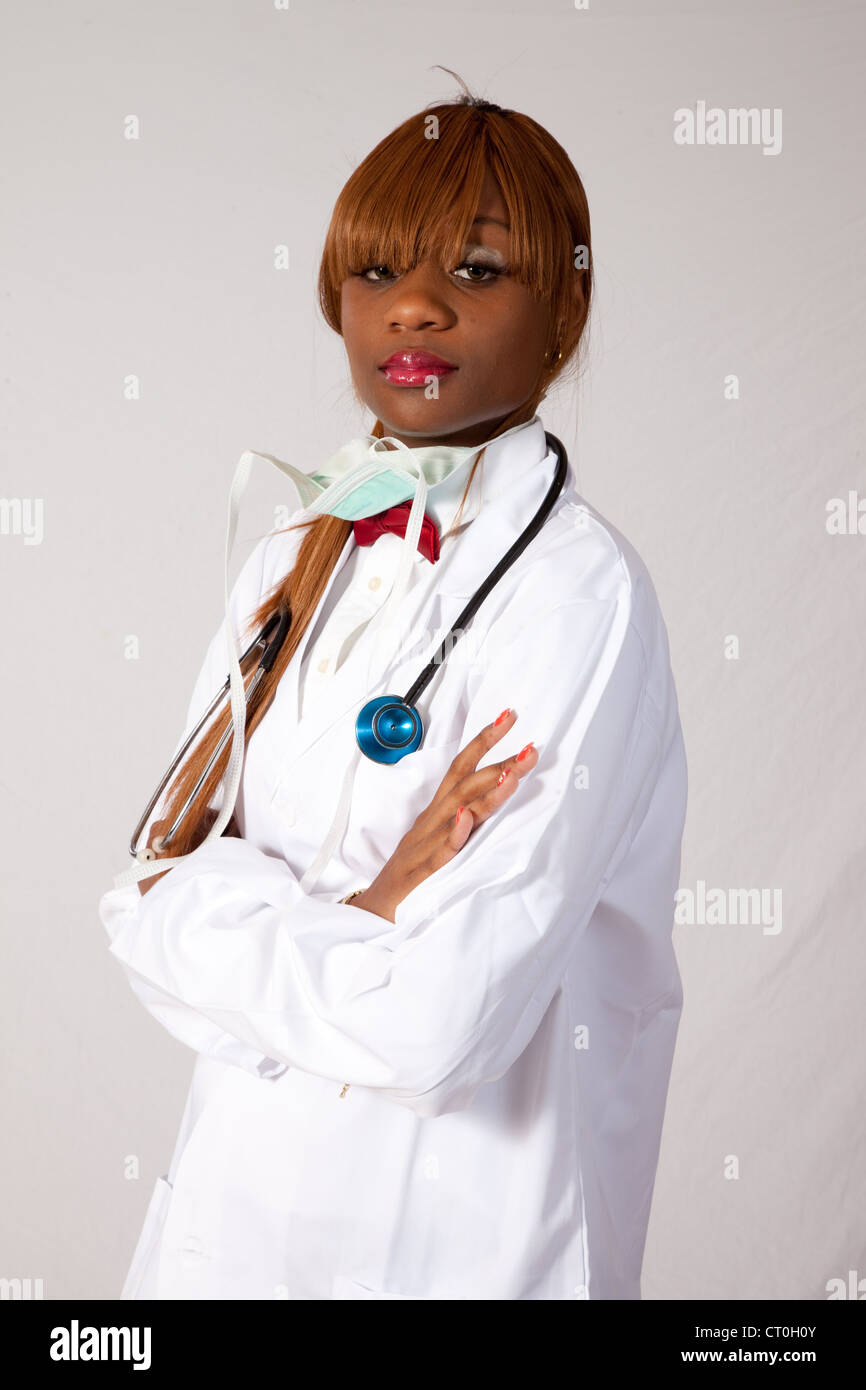 Pretty young female black health care worker in lab coat with a ...