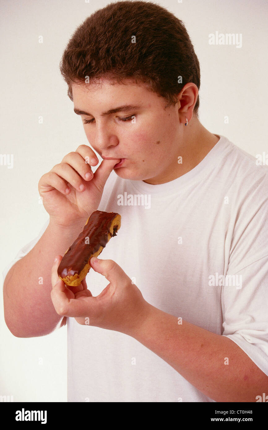 AN ADOLESCENT EATING Stock Photo - Alamy