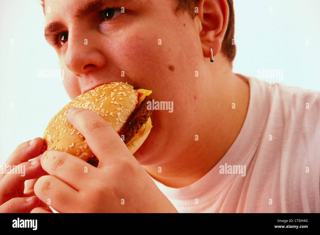 AN ADOLESCENT EATING Stock Photo - Alamy