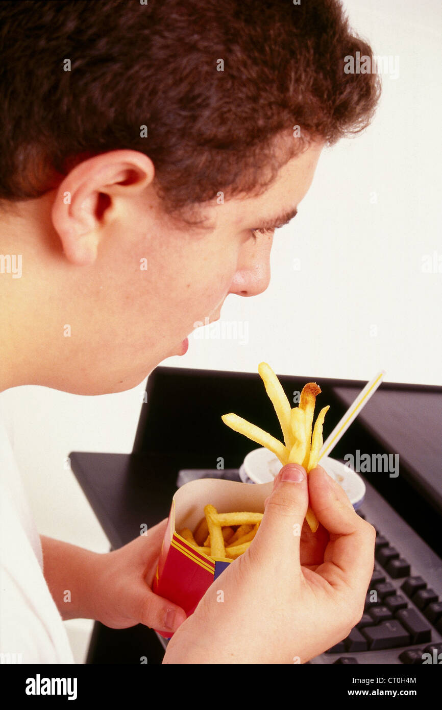 AN ADOLESCENT EATING Stock Photo - Alamy