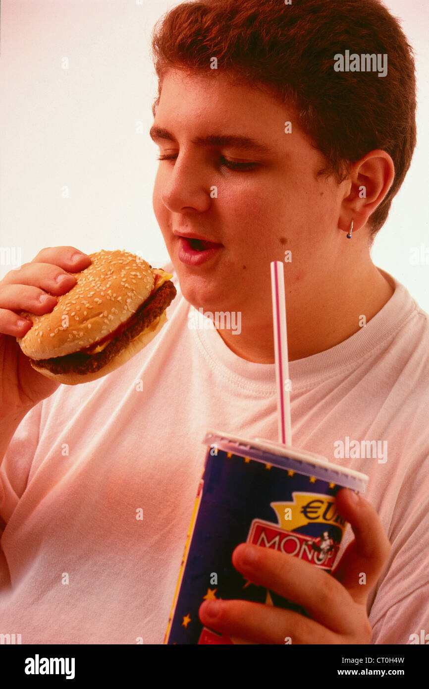 AN ADOLESCENT EATING Stock Photo - Alamy