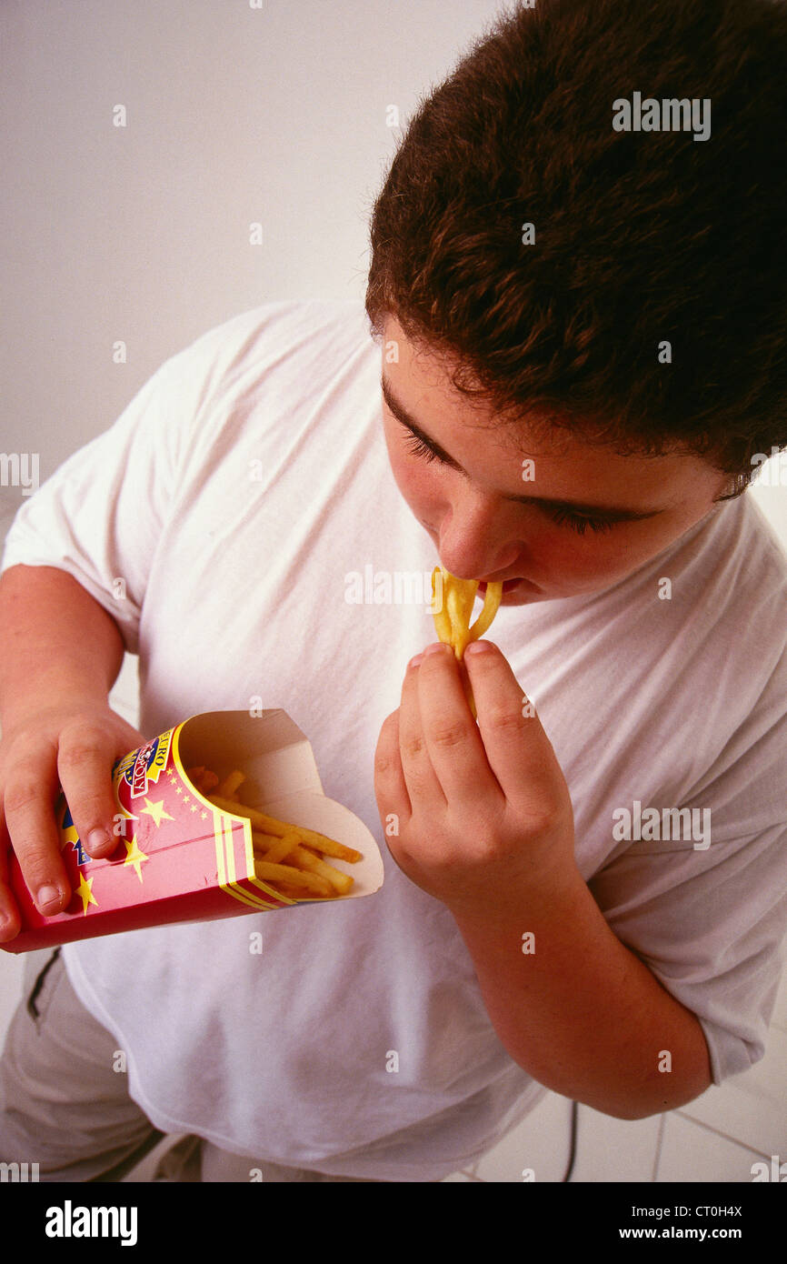 AN ADOLESCENT EATING Stock Photo - Alamy