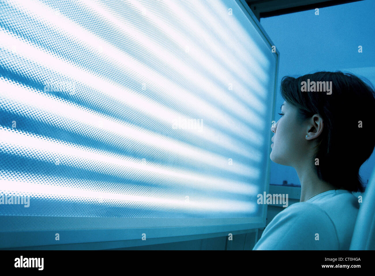 WOMAN LIGHT THERAPY Stock Photo - Alamy