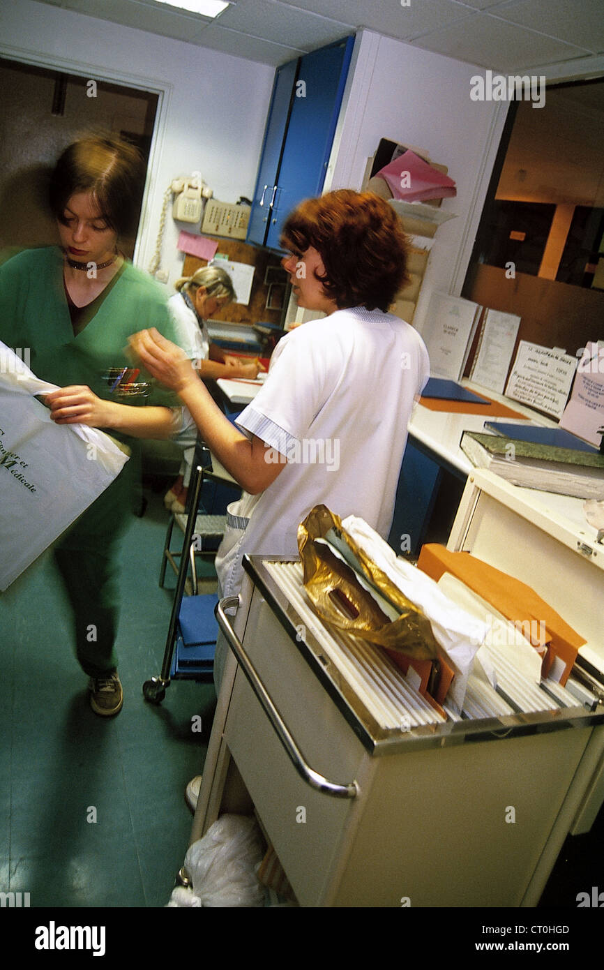 NURSE WITH PATIENT'S RECORD Stock Photo - Alamy
