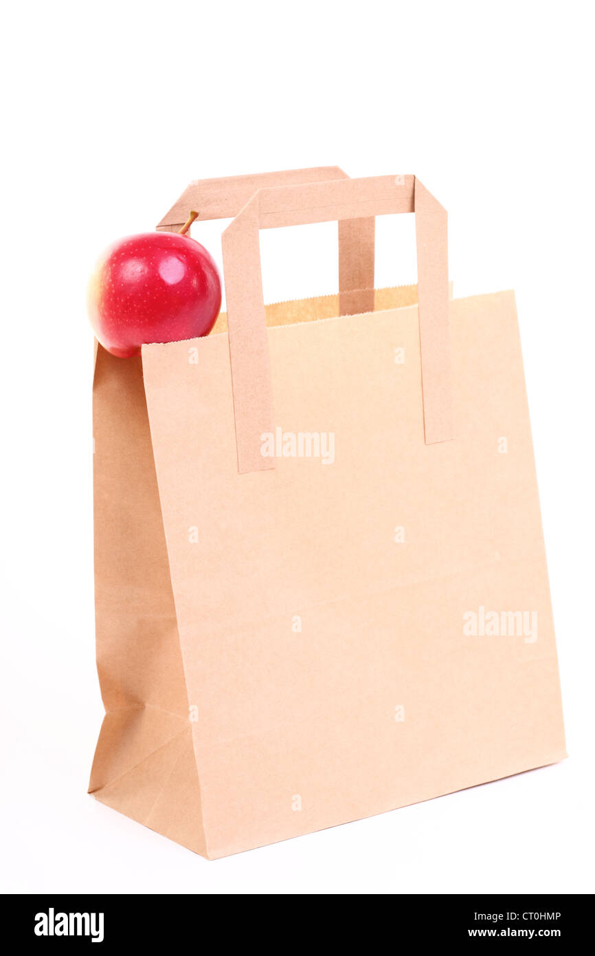 Shopping brown recycle gift bags and red apple isolated on white ...