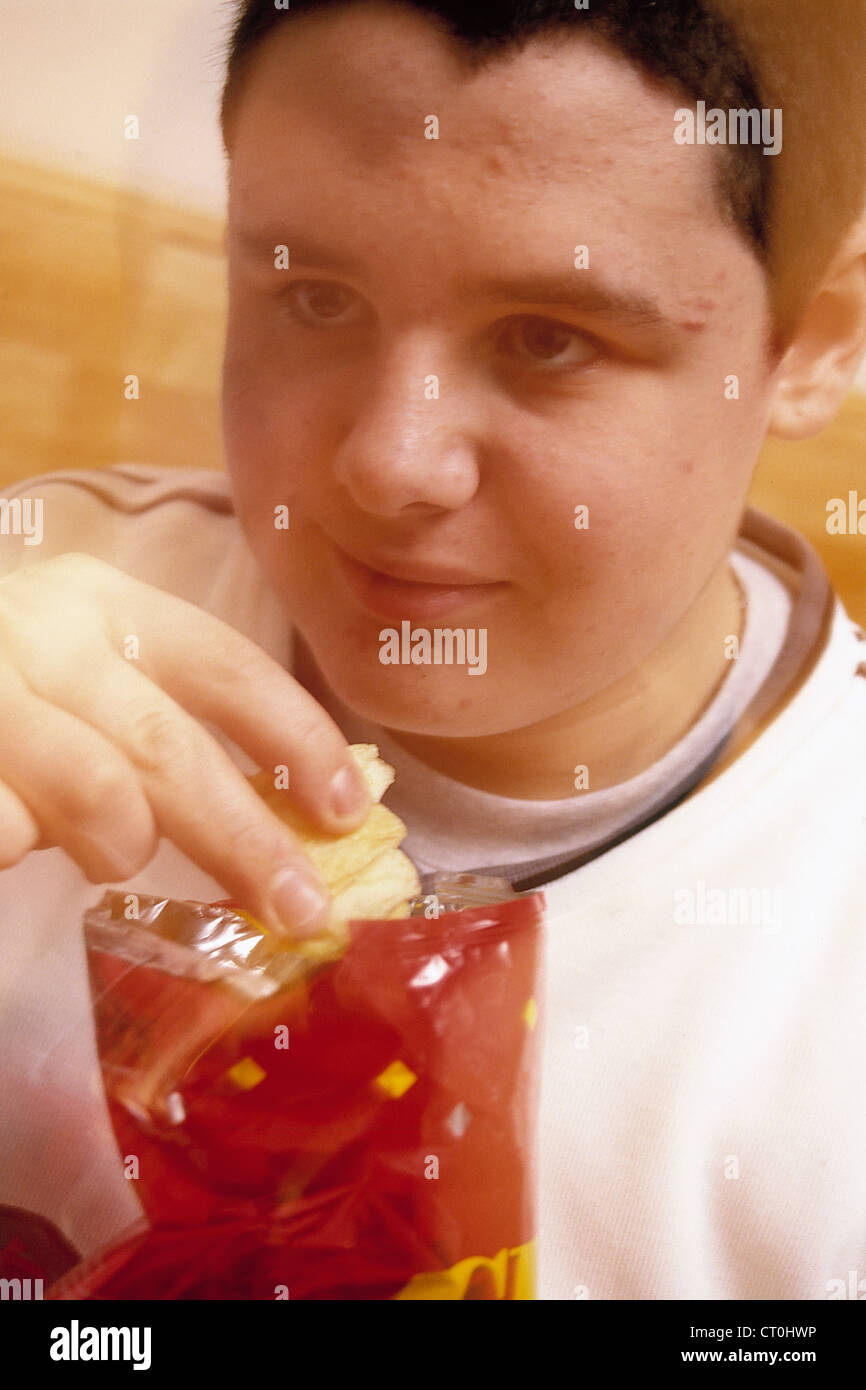 AN ADOLESCENT EATING Stock Photo - Alamy