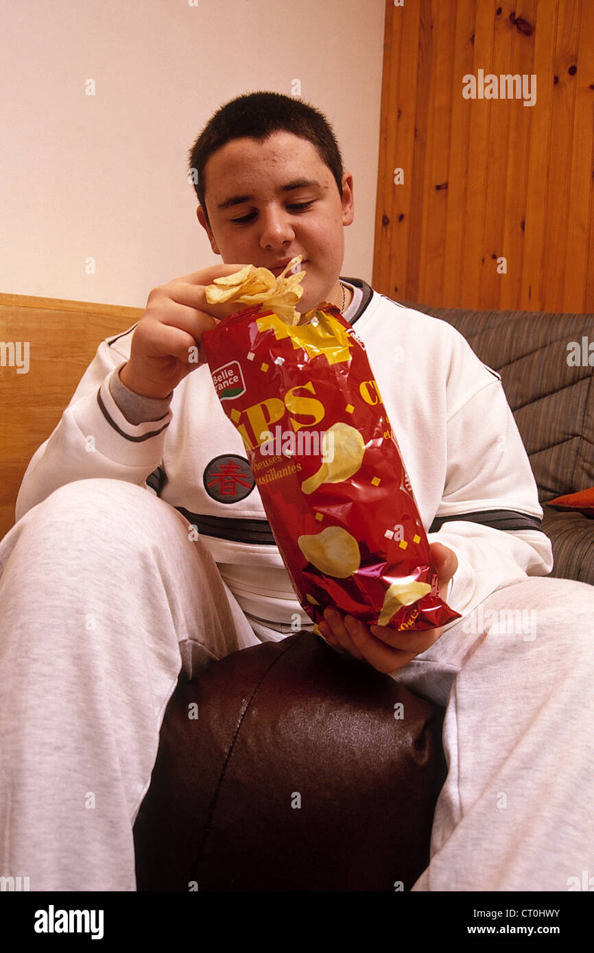 AN ADOLESCENT EATING Stock Photo - Alamy