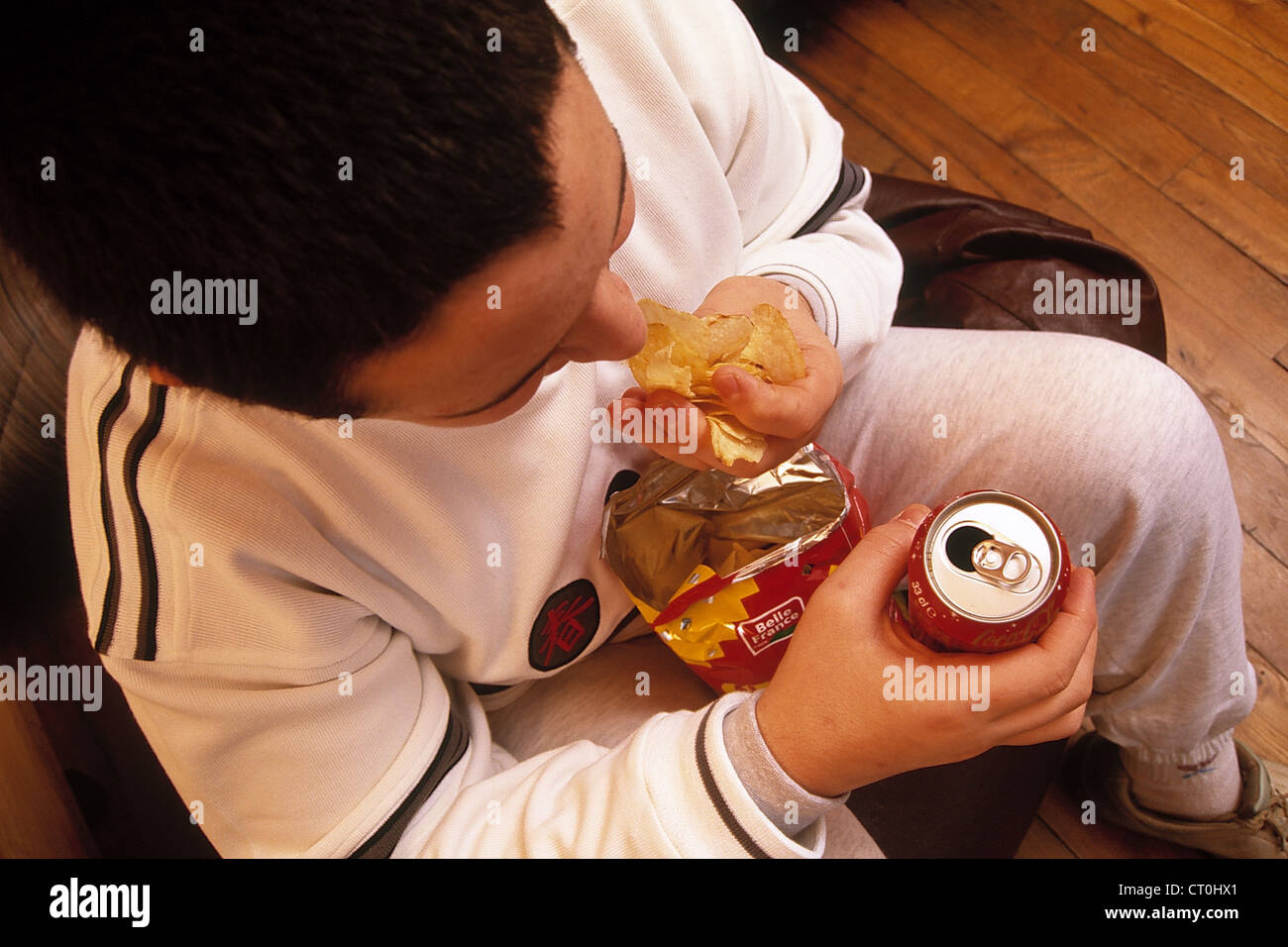 AN ADOLESCENT EATING Stock Photo - Alamy