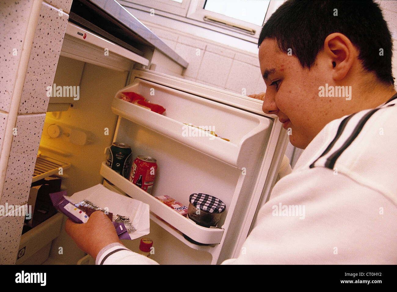 AN ADOLESCENT EATING Stock Photo - Alamy