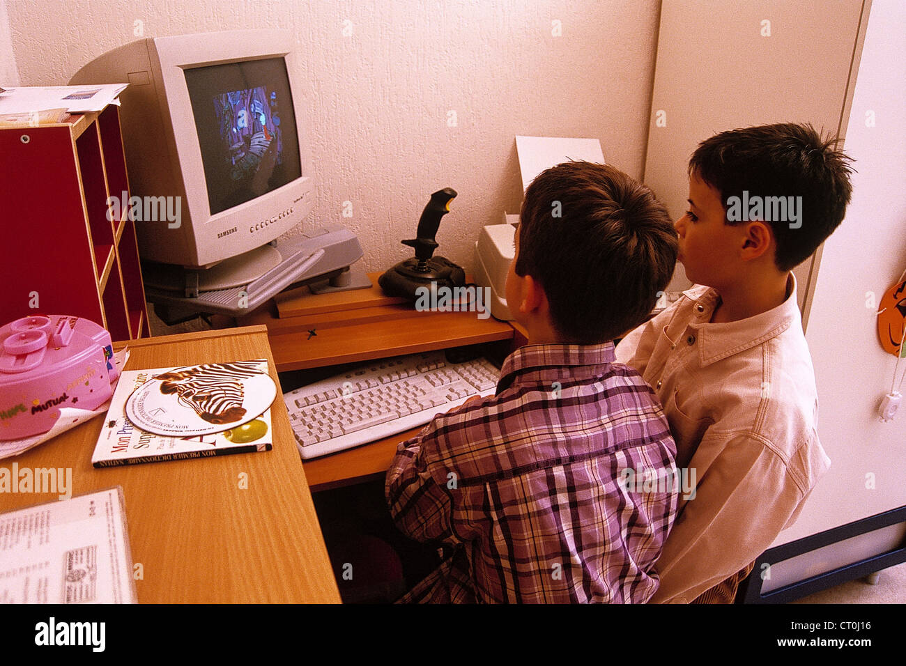 CHILD PLAYING WITH VIDEO GAME Stock Photo - Alamy