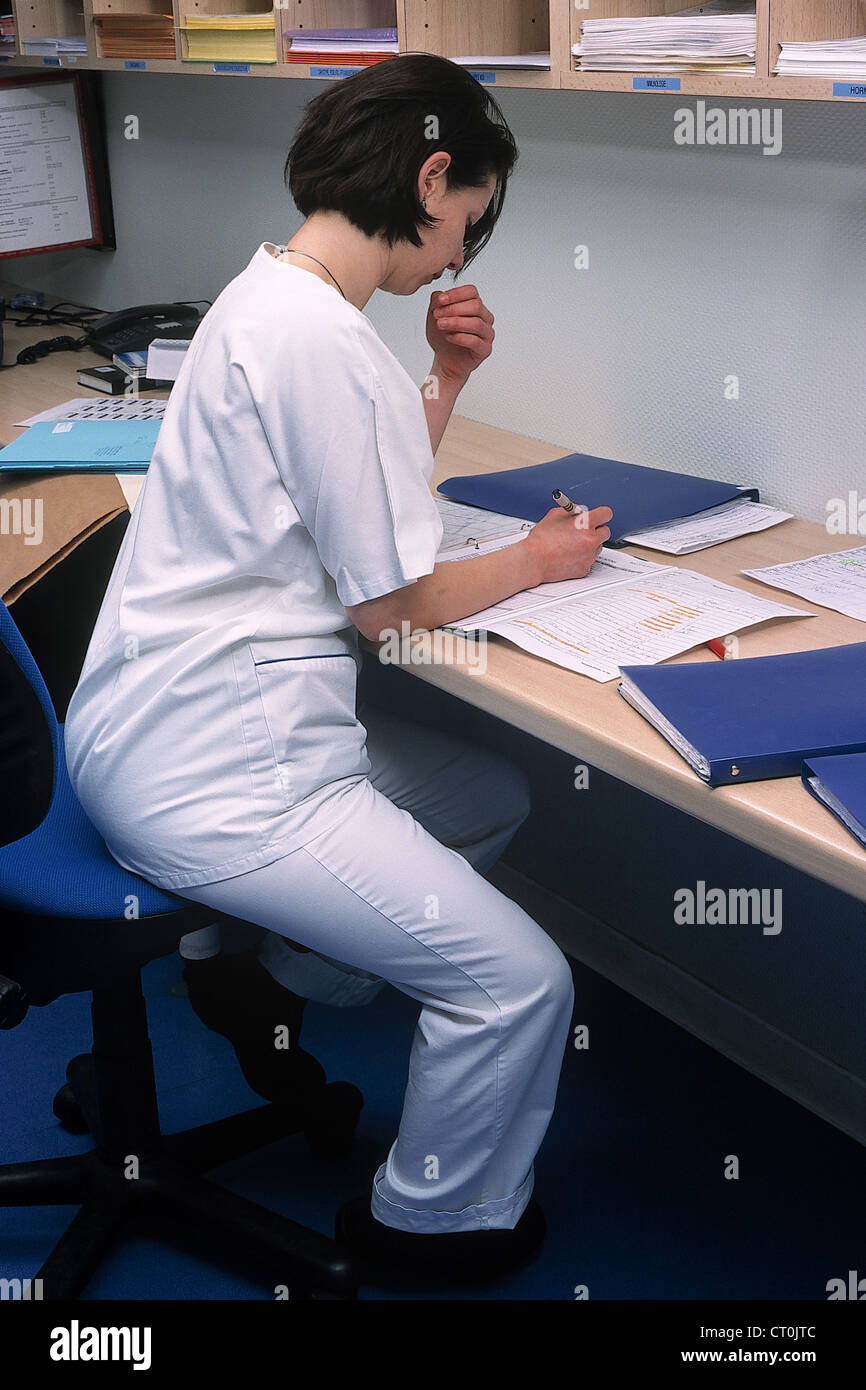 NURSE WITH PATIENT'S RECORD Stock Photo - Alamy