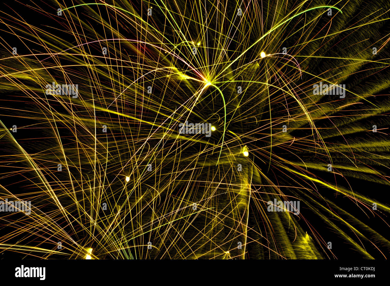 Brightly colored fireworks light up the night sky Stock Photo - Alamy