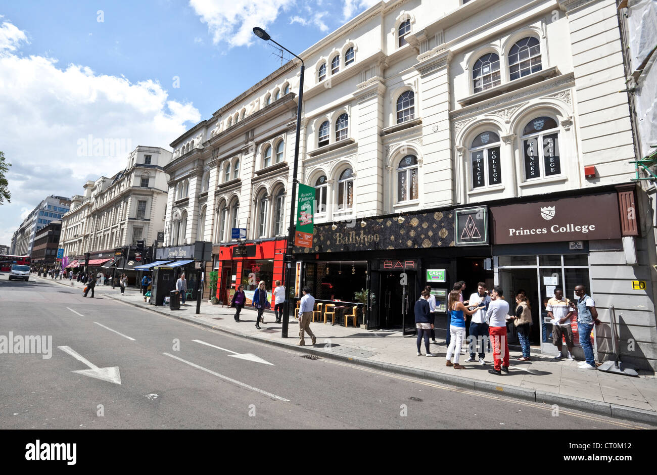Row of shops along New Oxford Street, City of London, WC1A, England, UK ...
