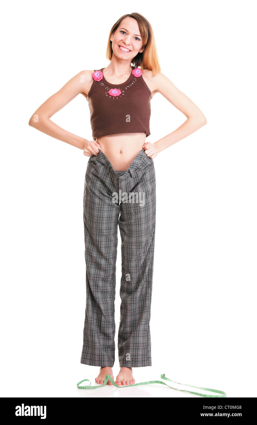 Beautiful young caucasian woman measuring her body with tape, isolated ...