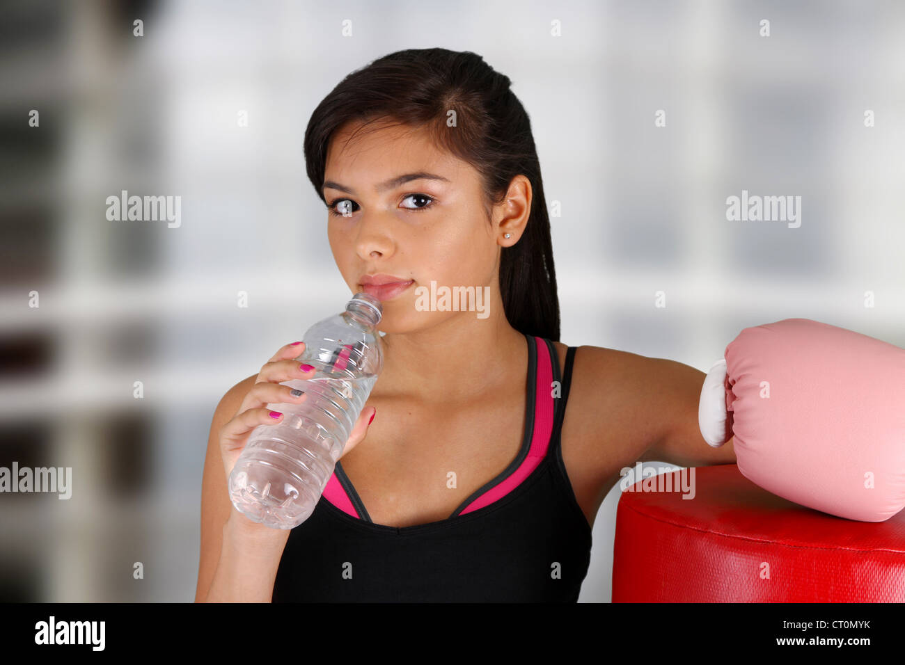 Teen girl working out in the gym Stock Photo - Alamy