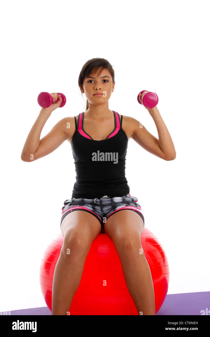 Teen girl working out in the gym Stock Photo - Alamy