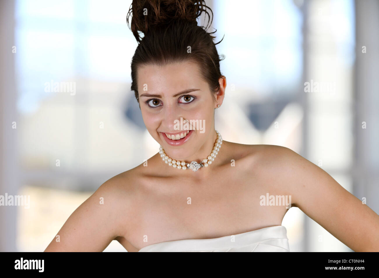 Woman in a wedding dress getting ready Stock Photo - Alamy
