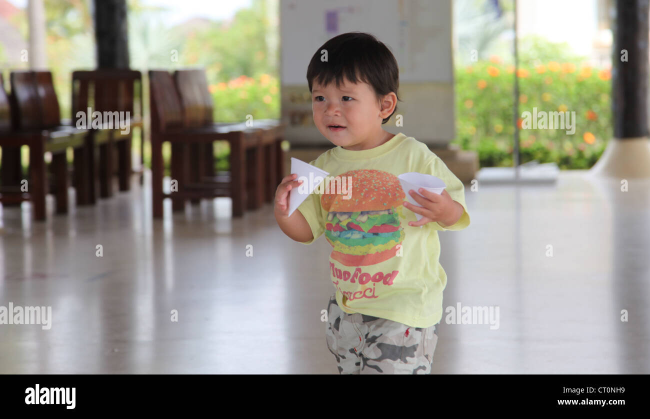 It's a photo of a choppy little Chinese Boy who is walking through the ...