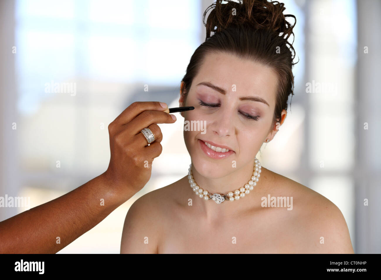 Woman in a wedding dress getting ready Stock Photo - Alamy