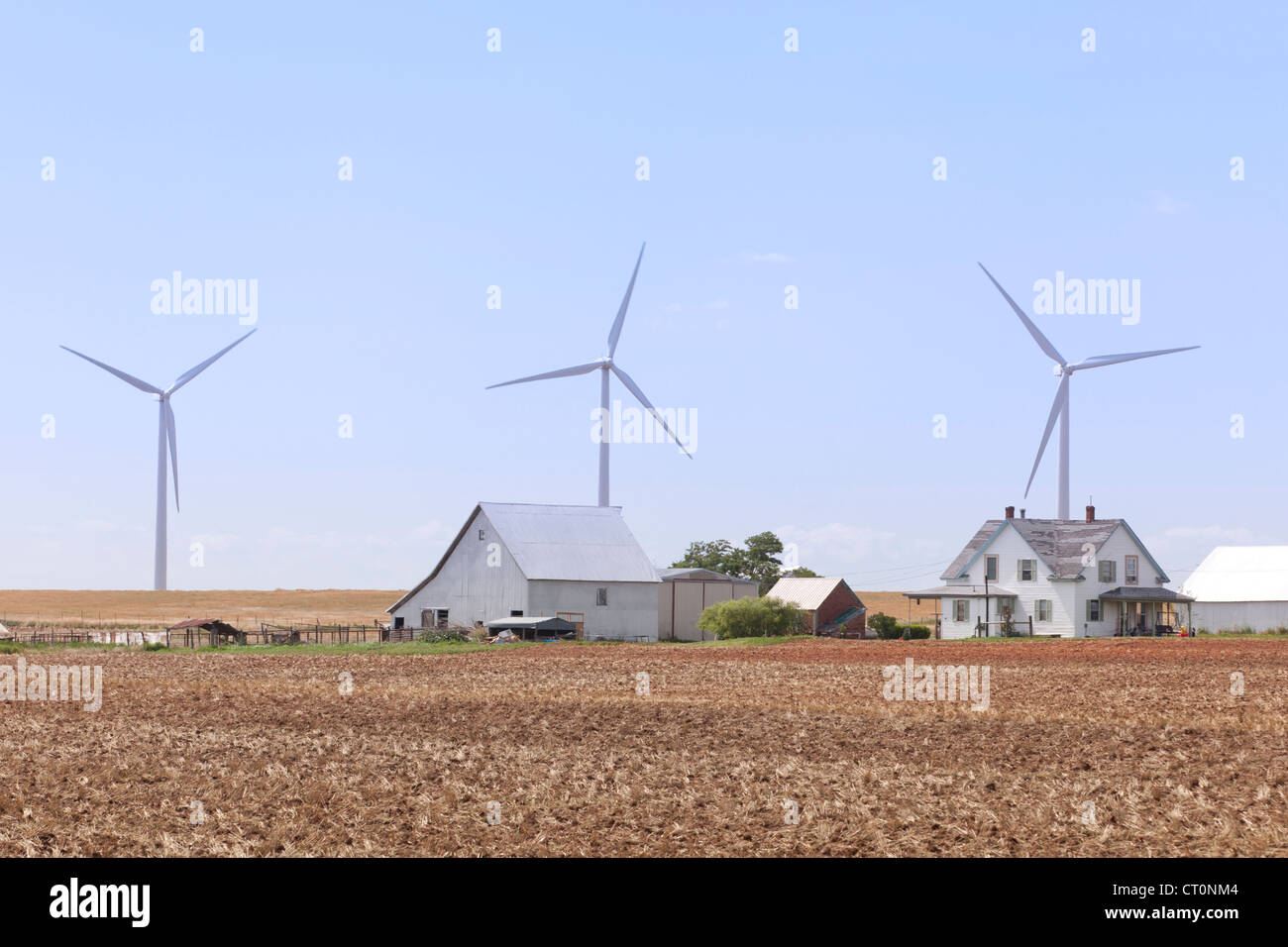 Wind turbines behind houses hi-res stock photography and images - Alamy