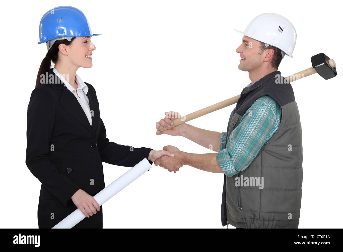 Tradesman shaking an engineer's hand Stock Photo - Alamy