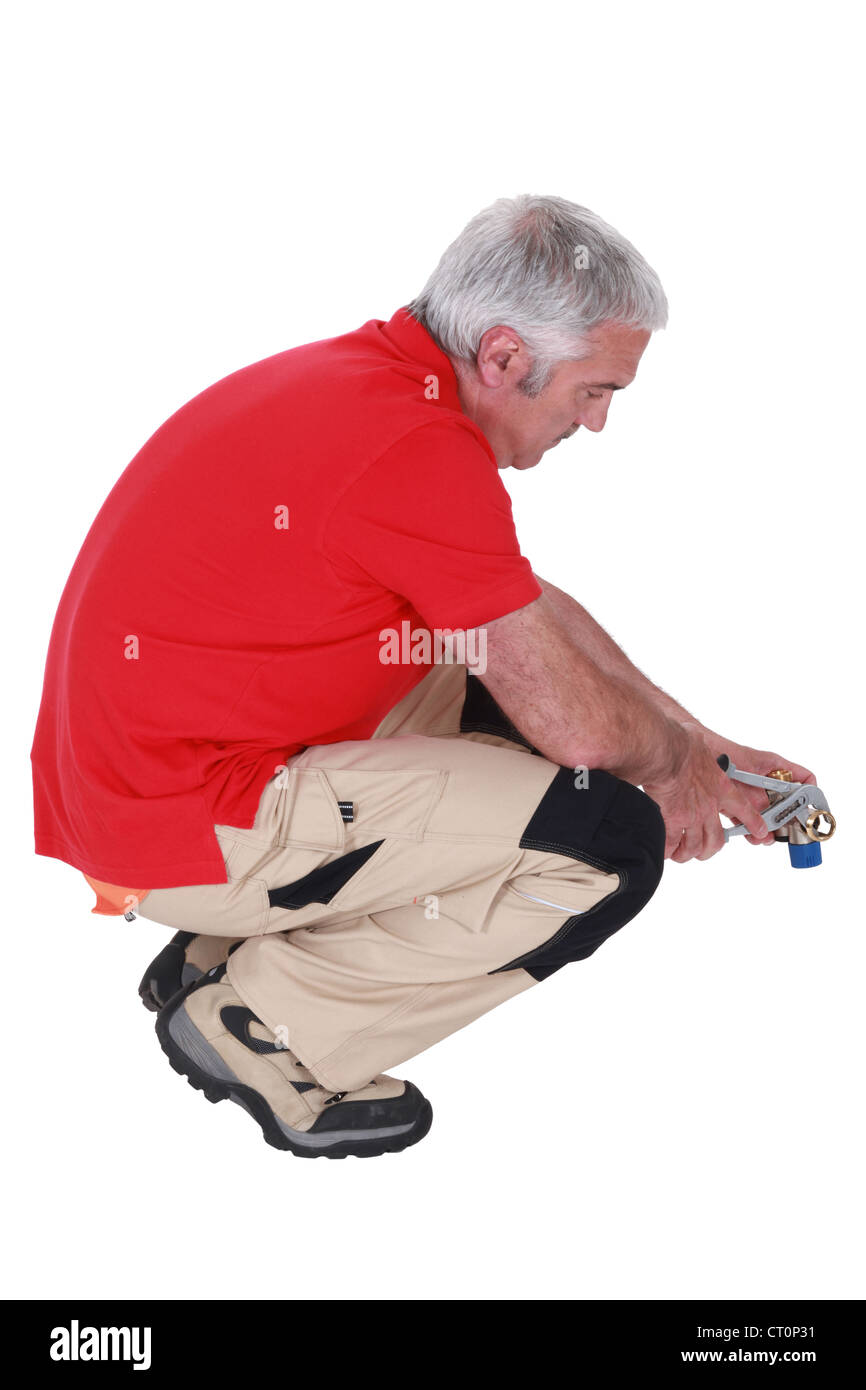 Man using pliers Stock Photo - Alamy