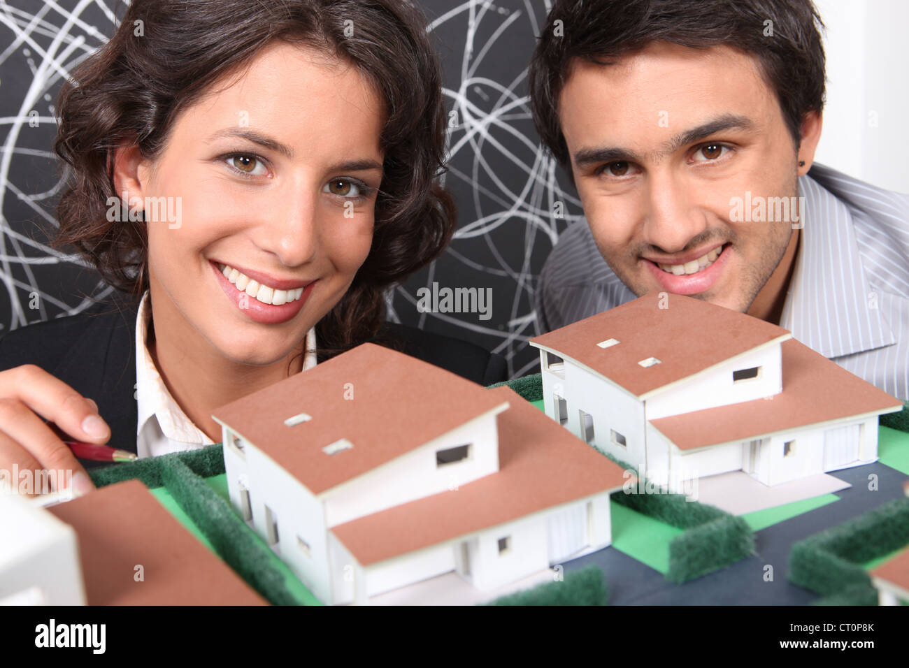 Architects looking model housing hi-res stock photography and images ...