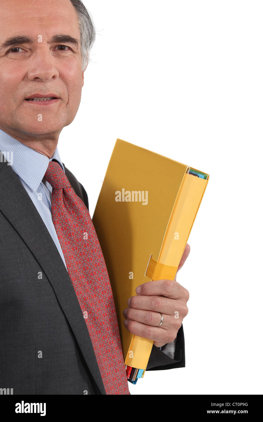 Senior businessman holding files hi-res stock photography and images ...