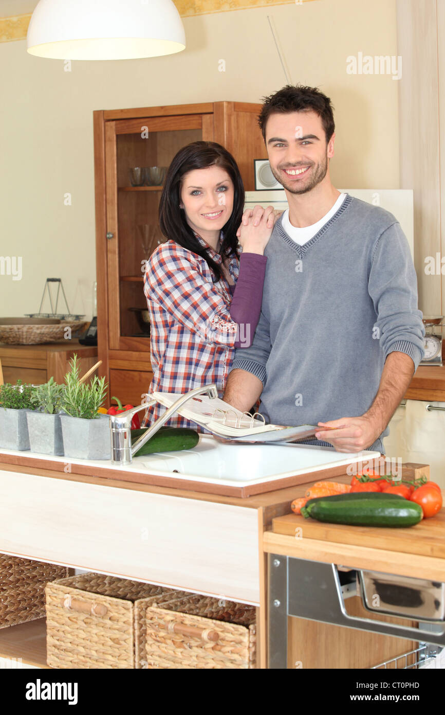 Happy couple in the kitchen Stock Photo - Alamy
