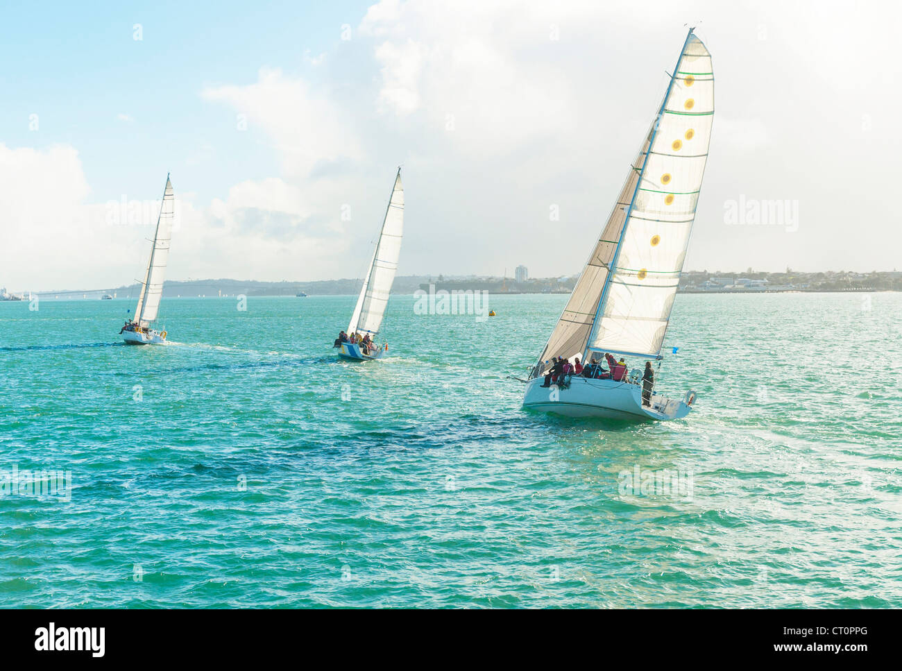 Three yachts racing each other on the blue turquoise sea Stock Photo ...