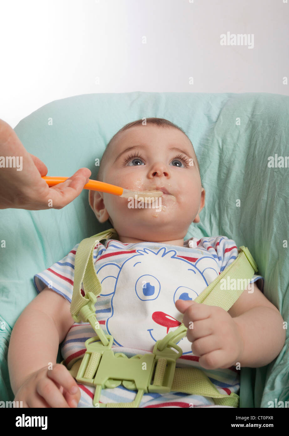 Mother feeding her happy little cute boy Stock Photo - Alamy