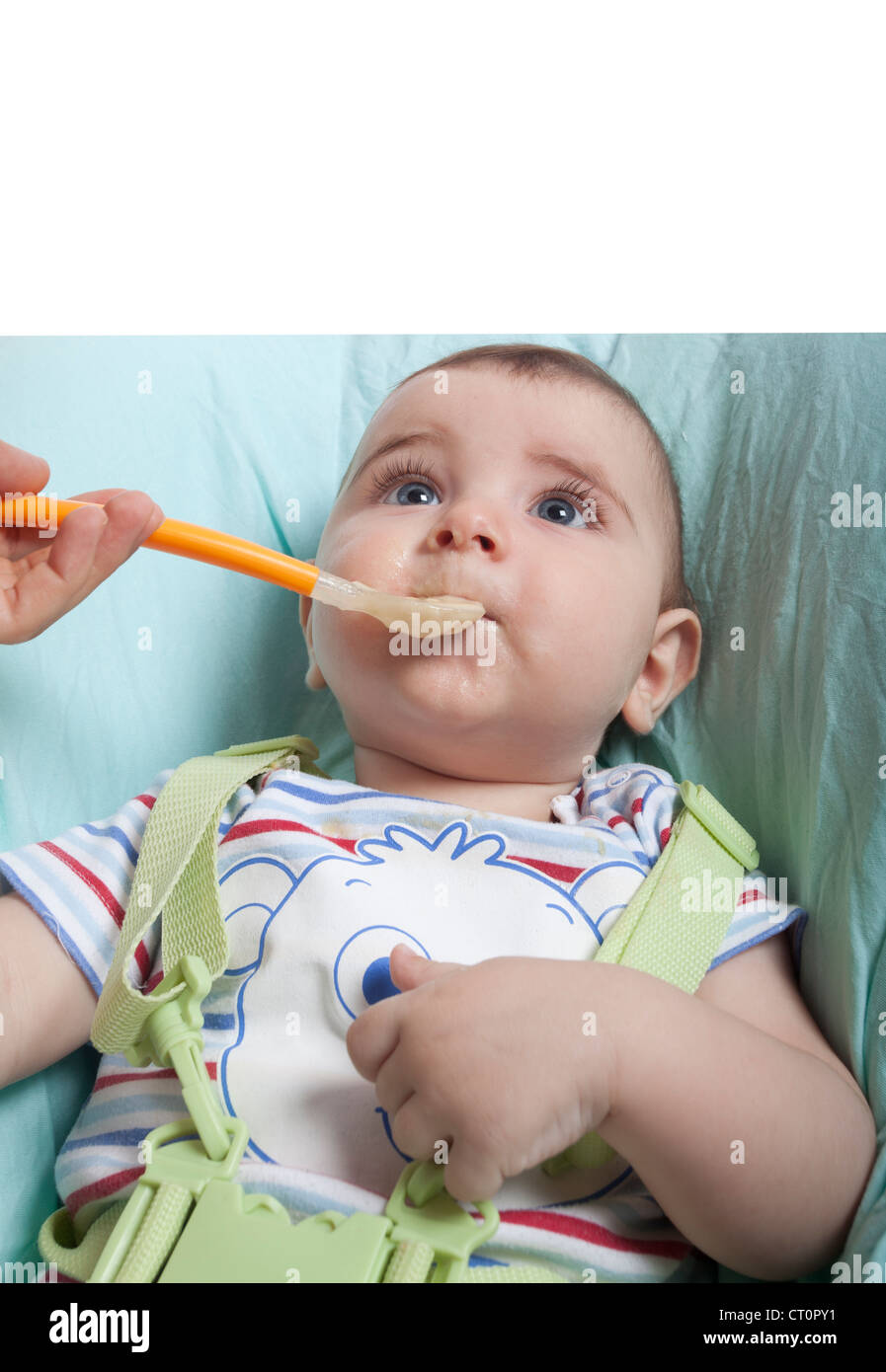 Mother feeding her happy little cute boy Stock Photo - Alamy