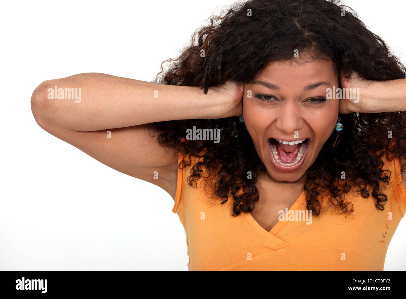 Woman covering her ears Stock Photo - Alamy