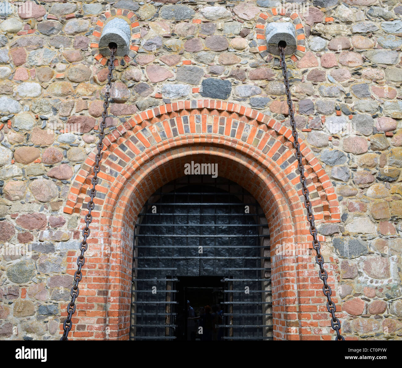 Entrance to hall of castle gates hang on chains. Trakai castle details ...