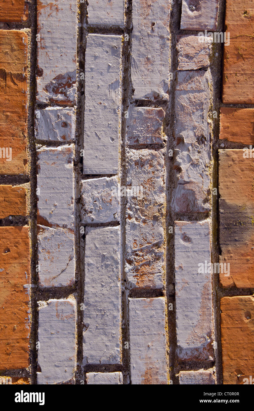 Wall made of red and colored bricks. Architectural decision Stock Photo ...