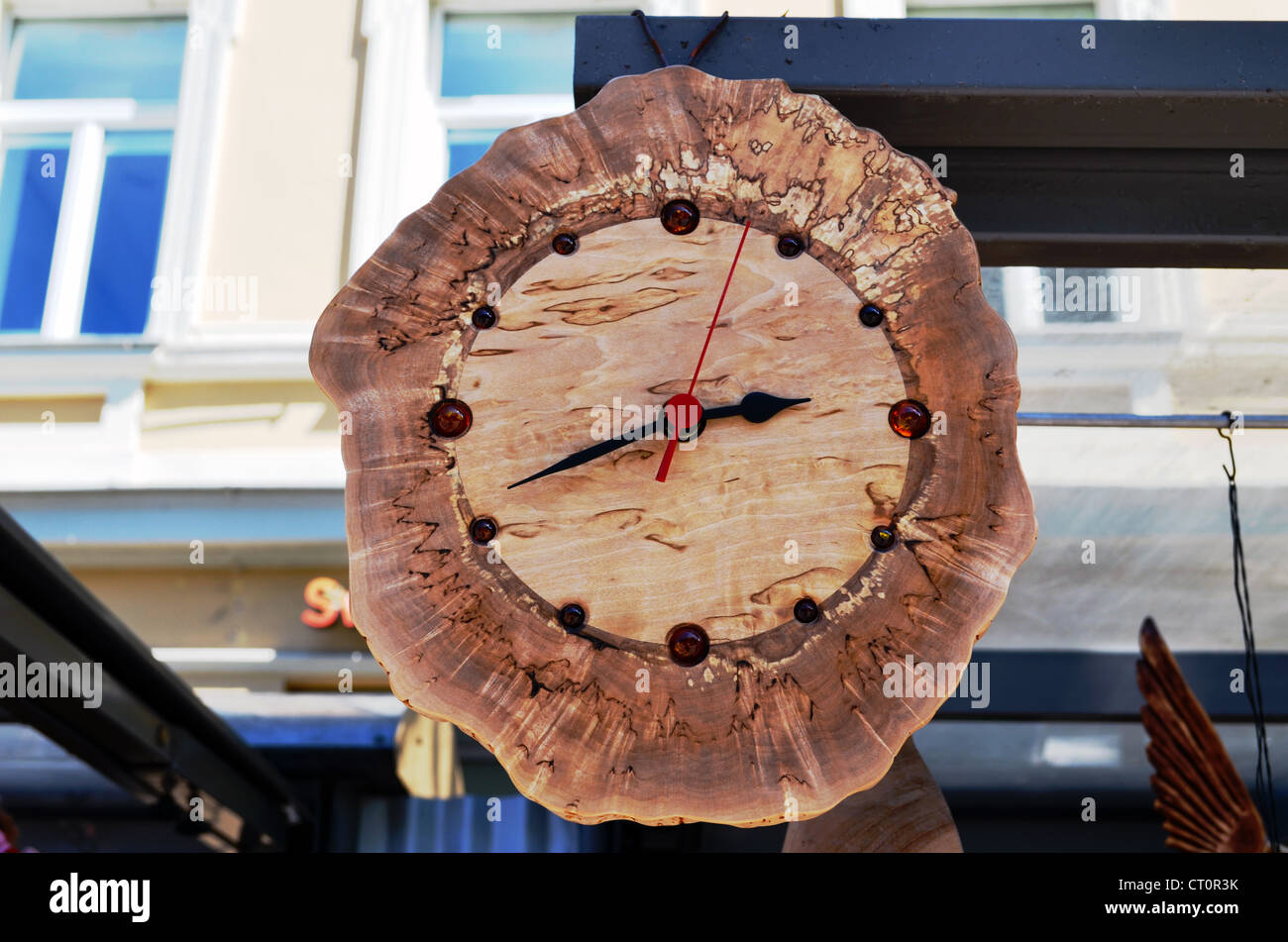 Handmade wooden clock decorated with amber flint stones Stock Photo - Alamy