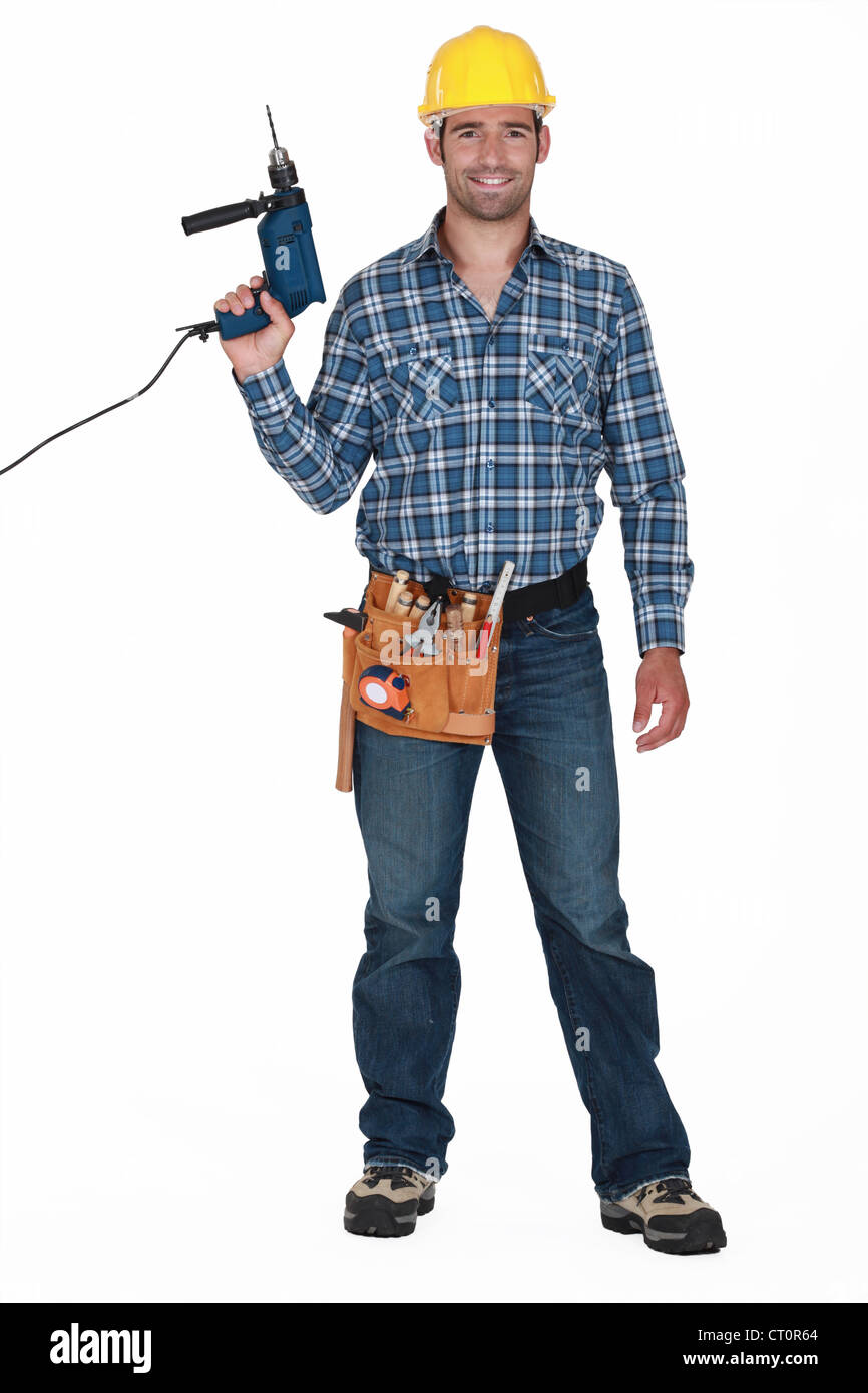 Workman with a drill Stock Photo - Alamy