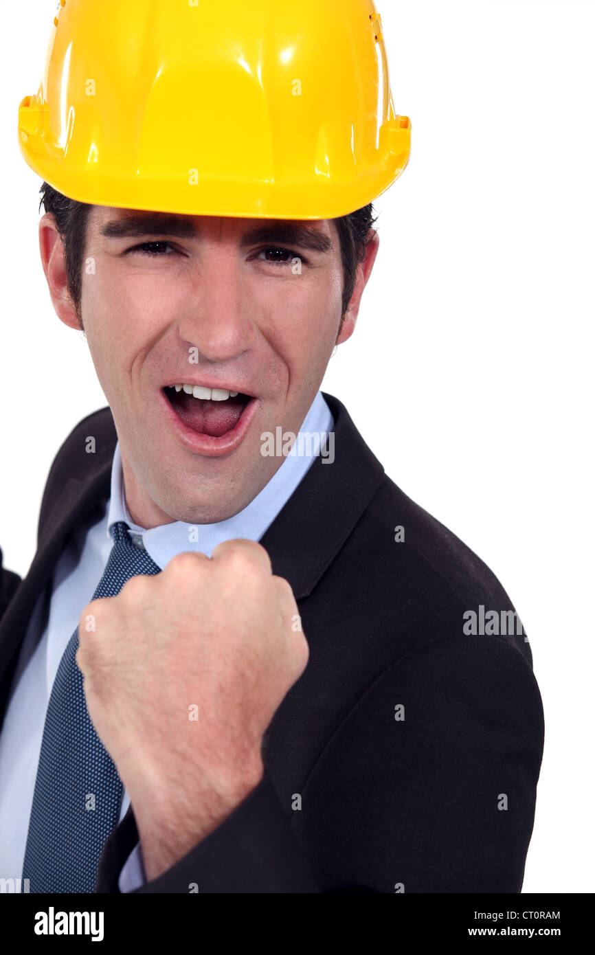 Man with helmet jubilant Stock Photo - Alamy
