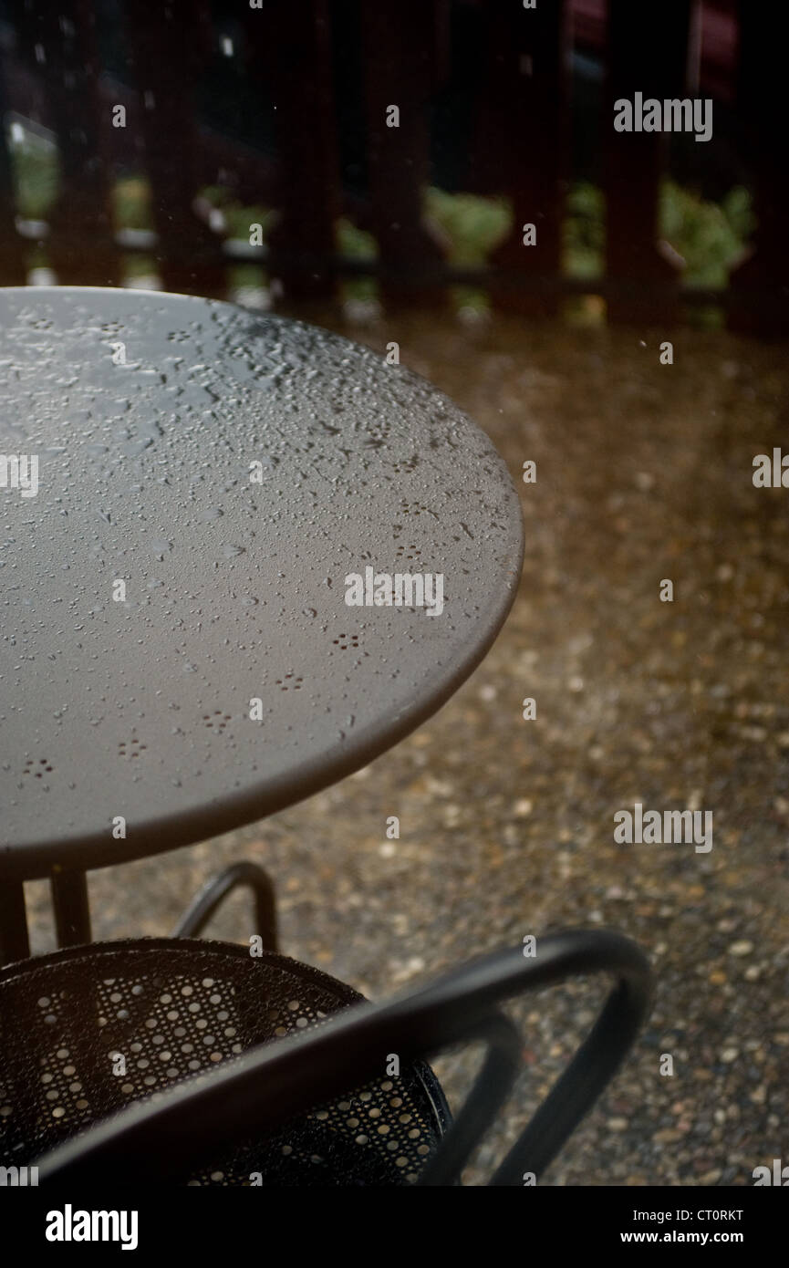 Restaurant terrace in the rain Stock Photo - Alamy