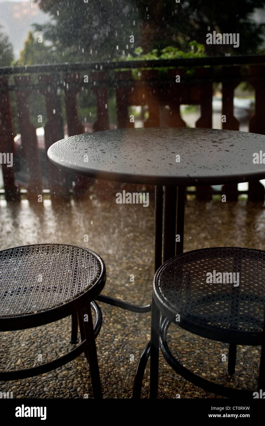 Restaurant terrace in the rain Stock Photo - Alamy