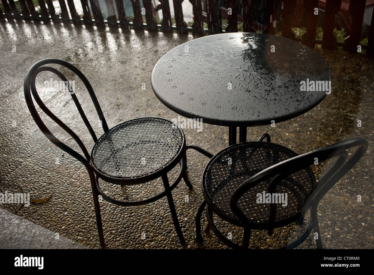 Restaurant terrace in the rain Stock Photo - Alamy