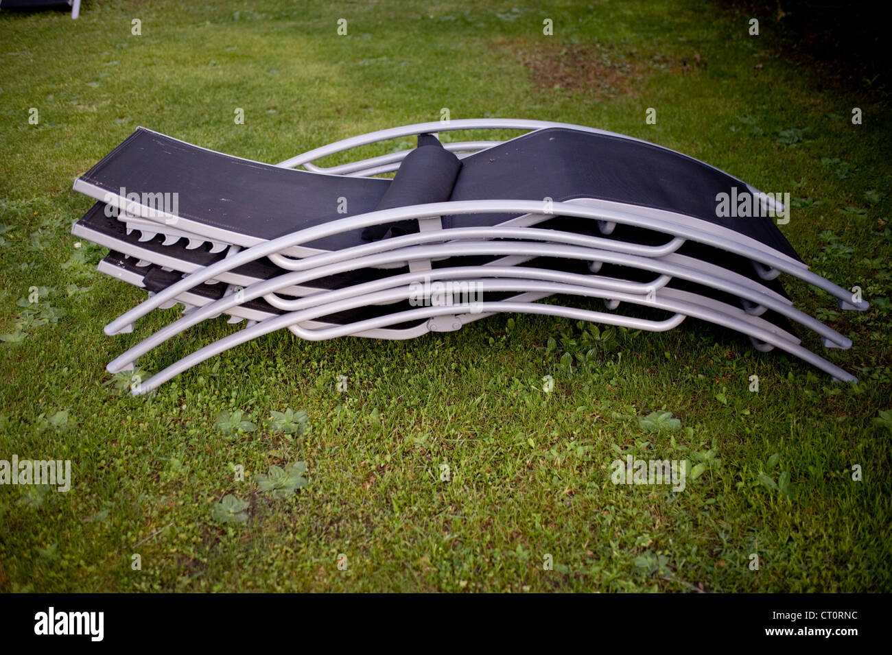 Stacked Sunbeds in low season Stock Photo - Alamy