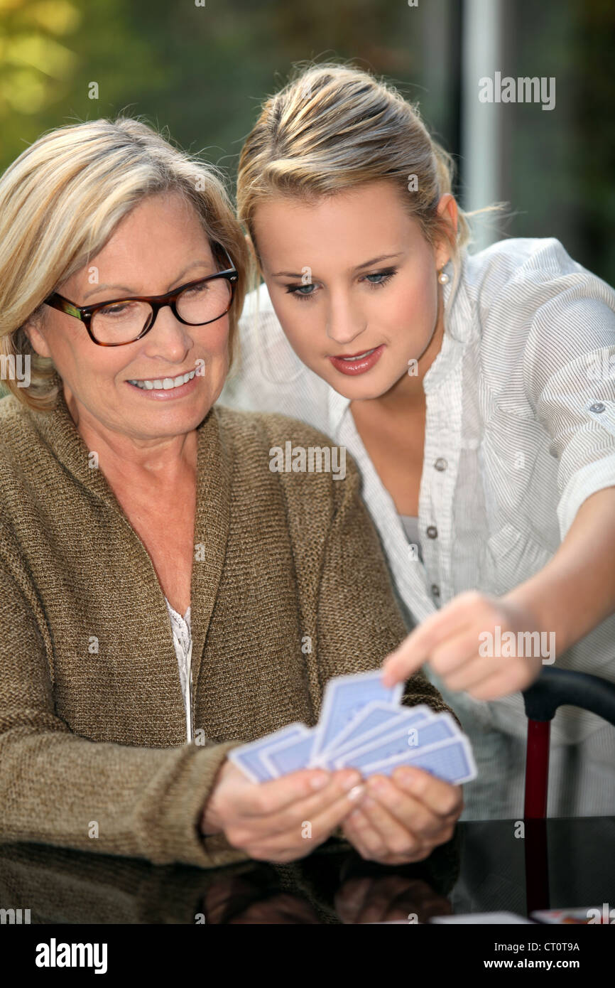 Grandmother and granddaughter playing cards Stock Photo - Alamy
