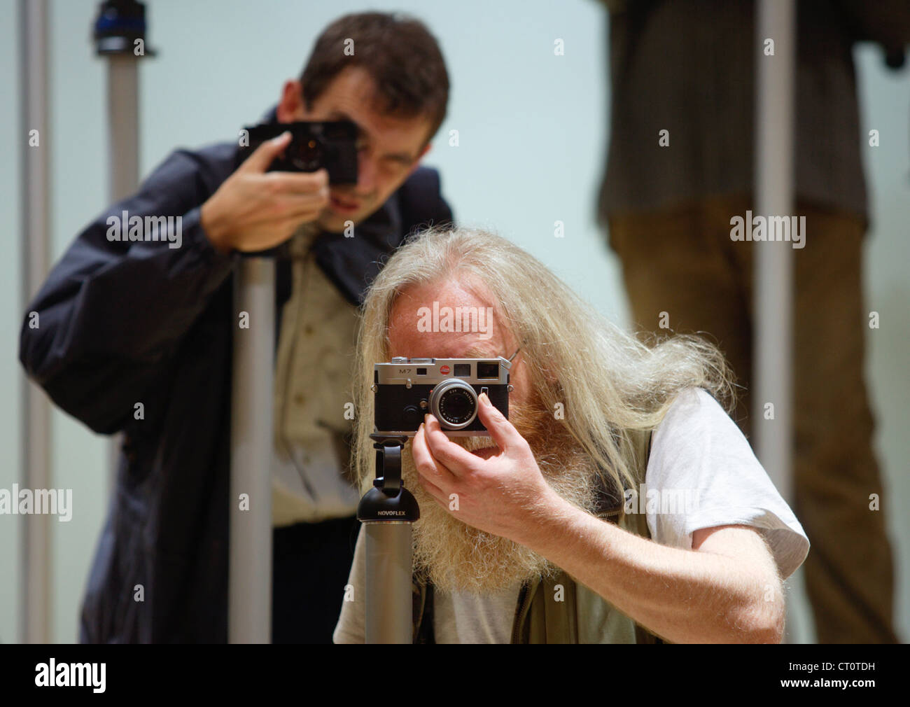 Cologne, Photokina, visitors stand on LEICA Stock Photo - Alamy